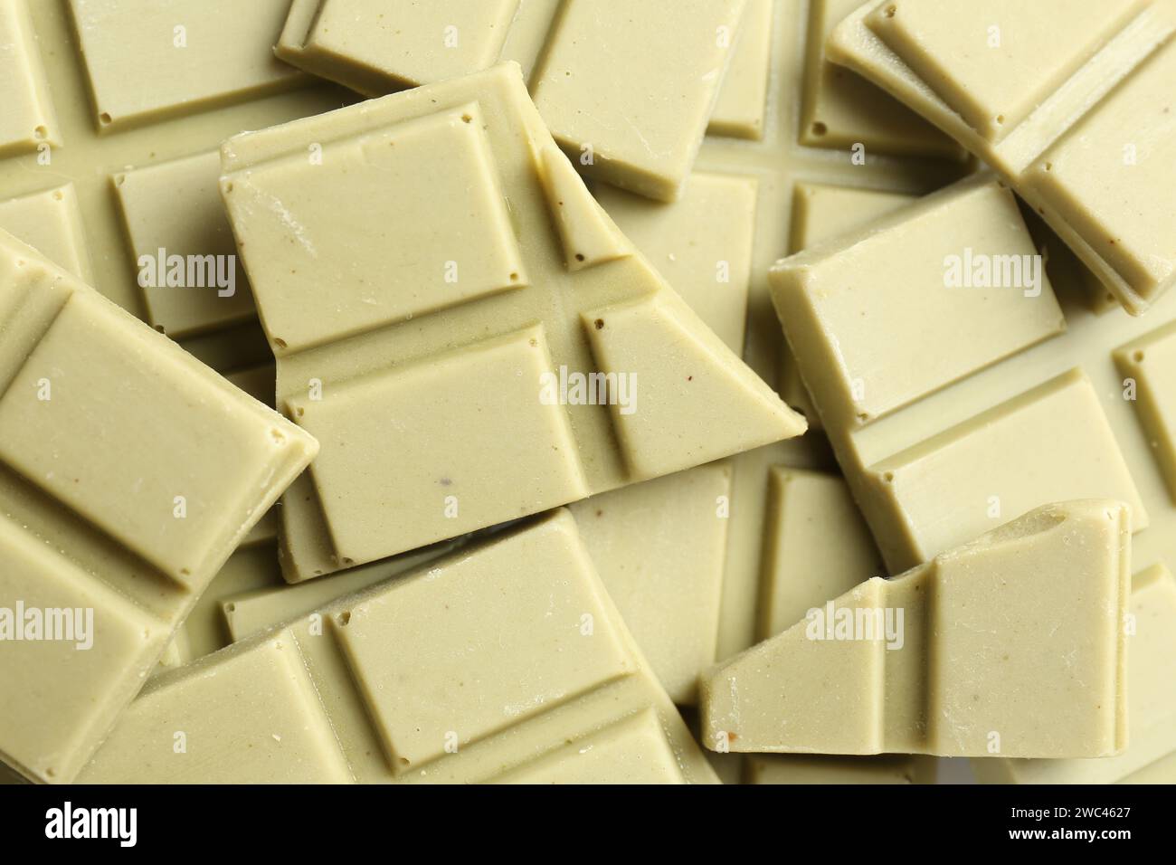 Pieces of tasty matcha chocolate bars as background, top view Stock ...