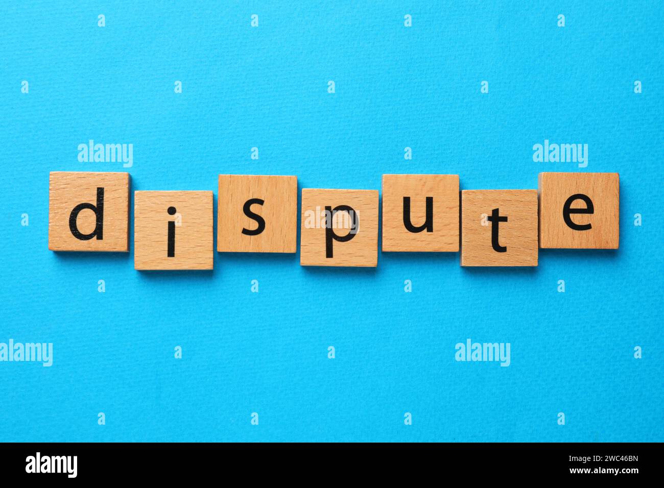 Word Dispute made with wooden cubes on light blue background, top view ...