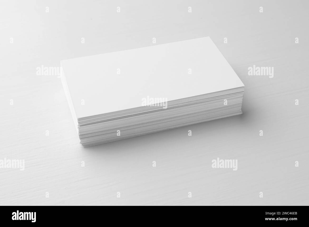 Stack of blank business cards on white table. Mockup for design Stock ...