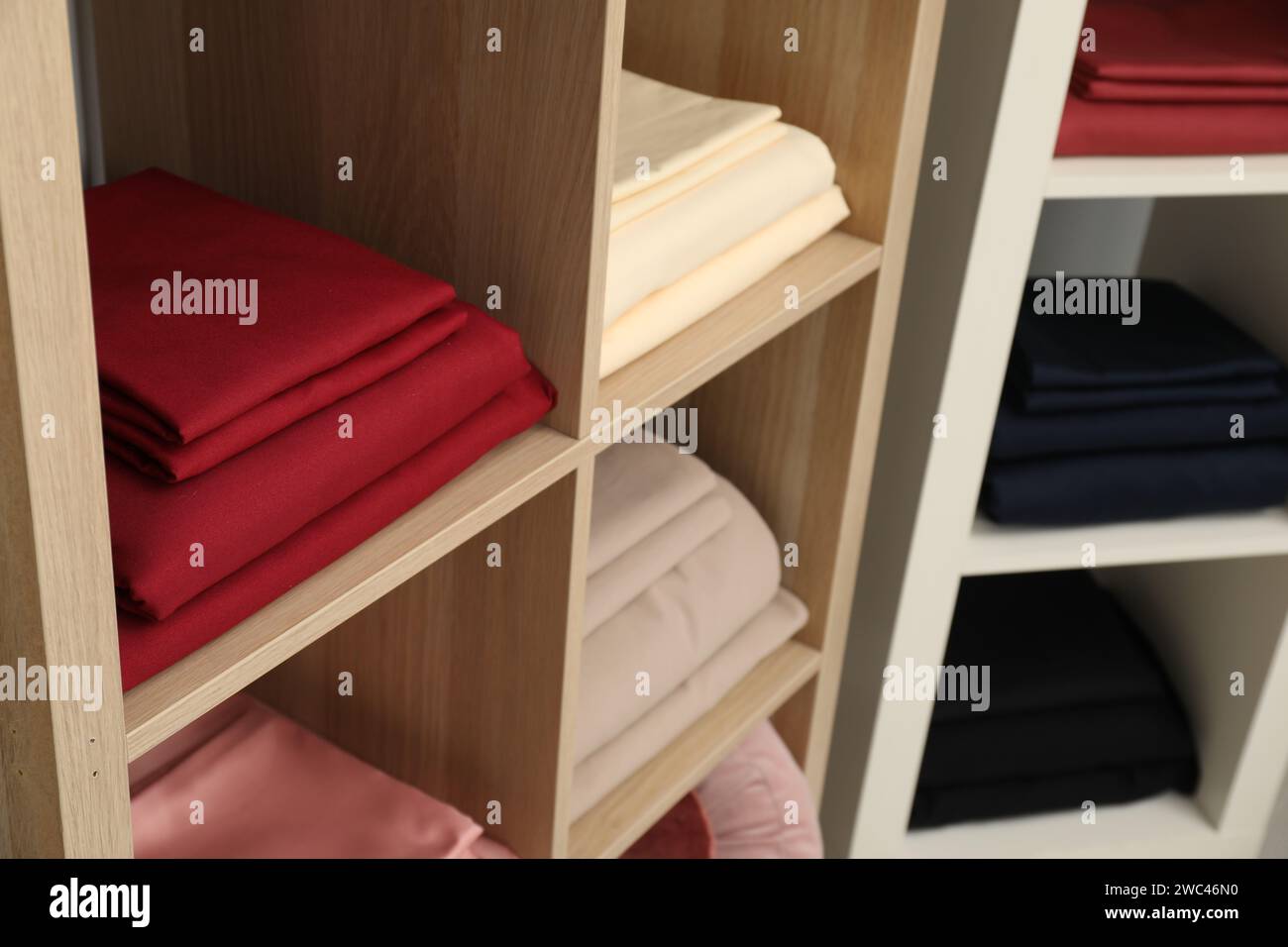 Different colorful bed linens on display in home textiles store Stock ...