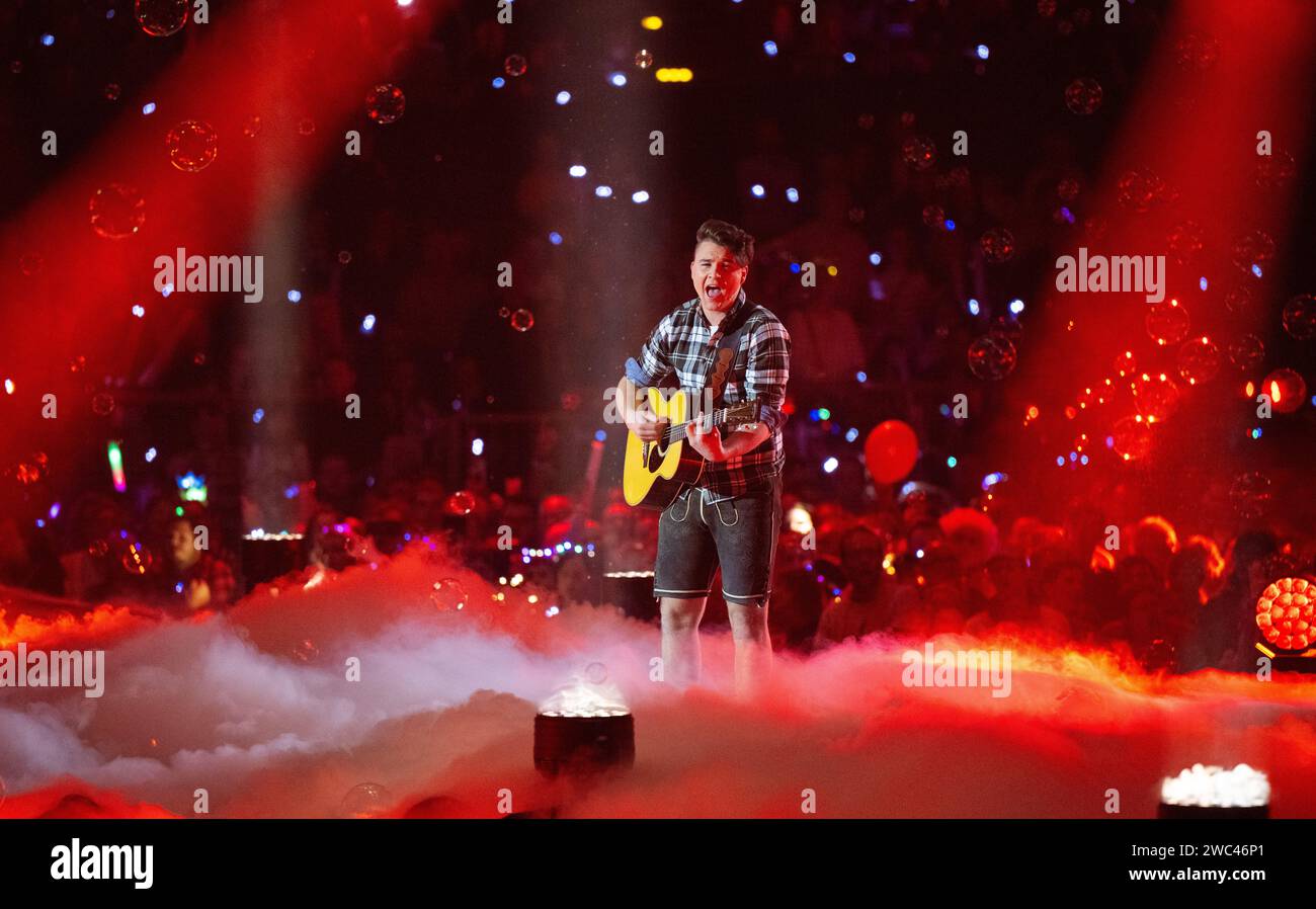 Berlin, Germany. 13th Jan, 2024. Chris Steger sings at the live TV show ...