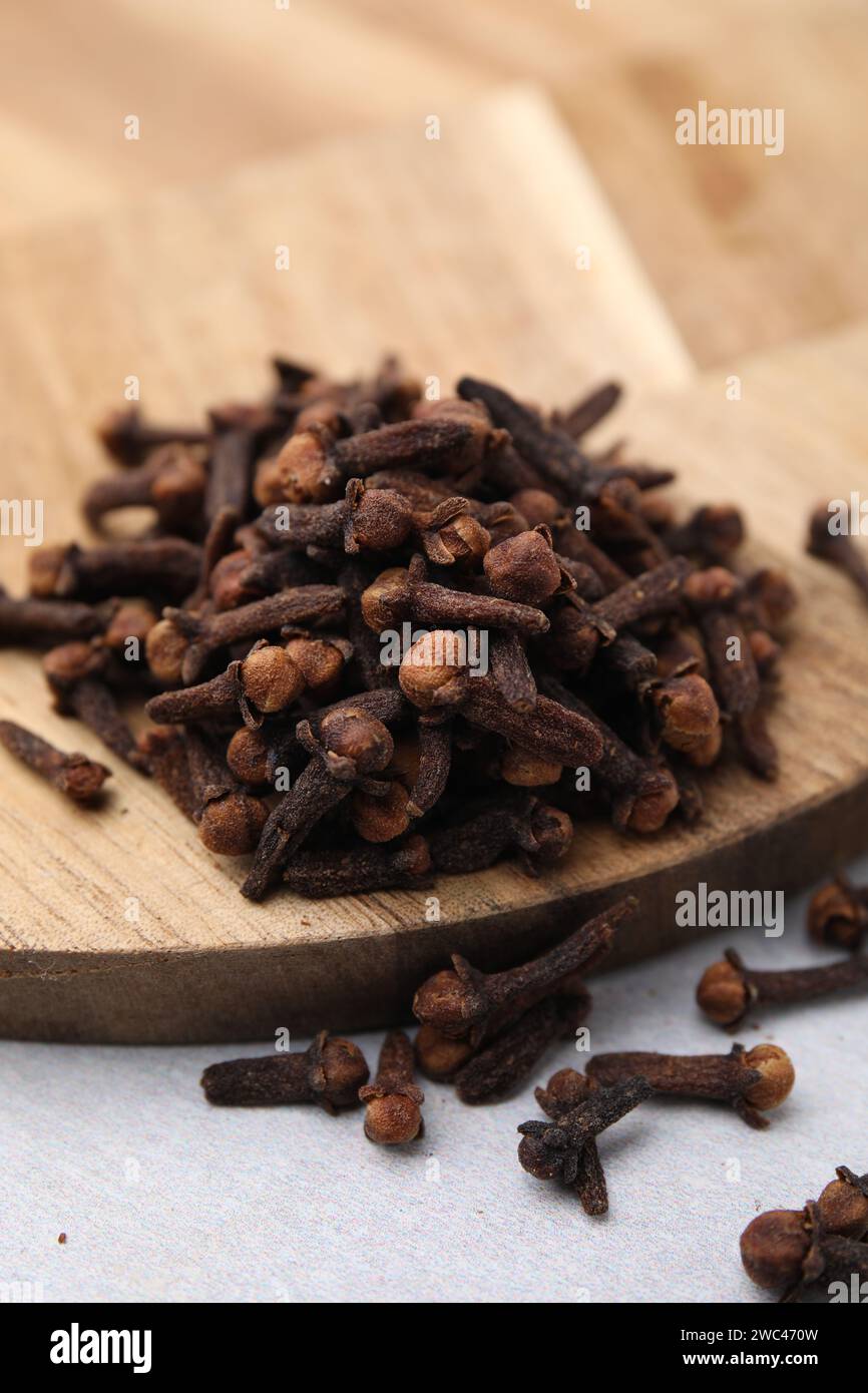 Pile of aromatic cloves on light table, closeup Stock Photo - Alamy