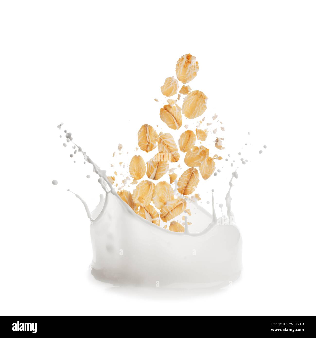 Rolled oats falling into splashing milk on white background Stock Photo ...