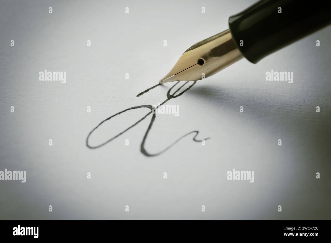 Signing on sheet of paper with fountain pen, closeup Stock Photo - Alamy