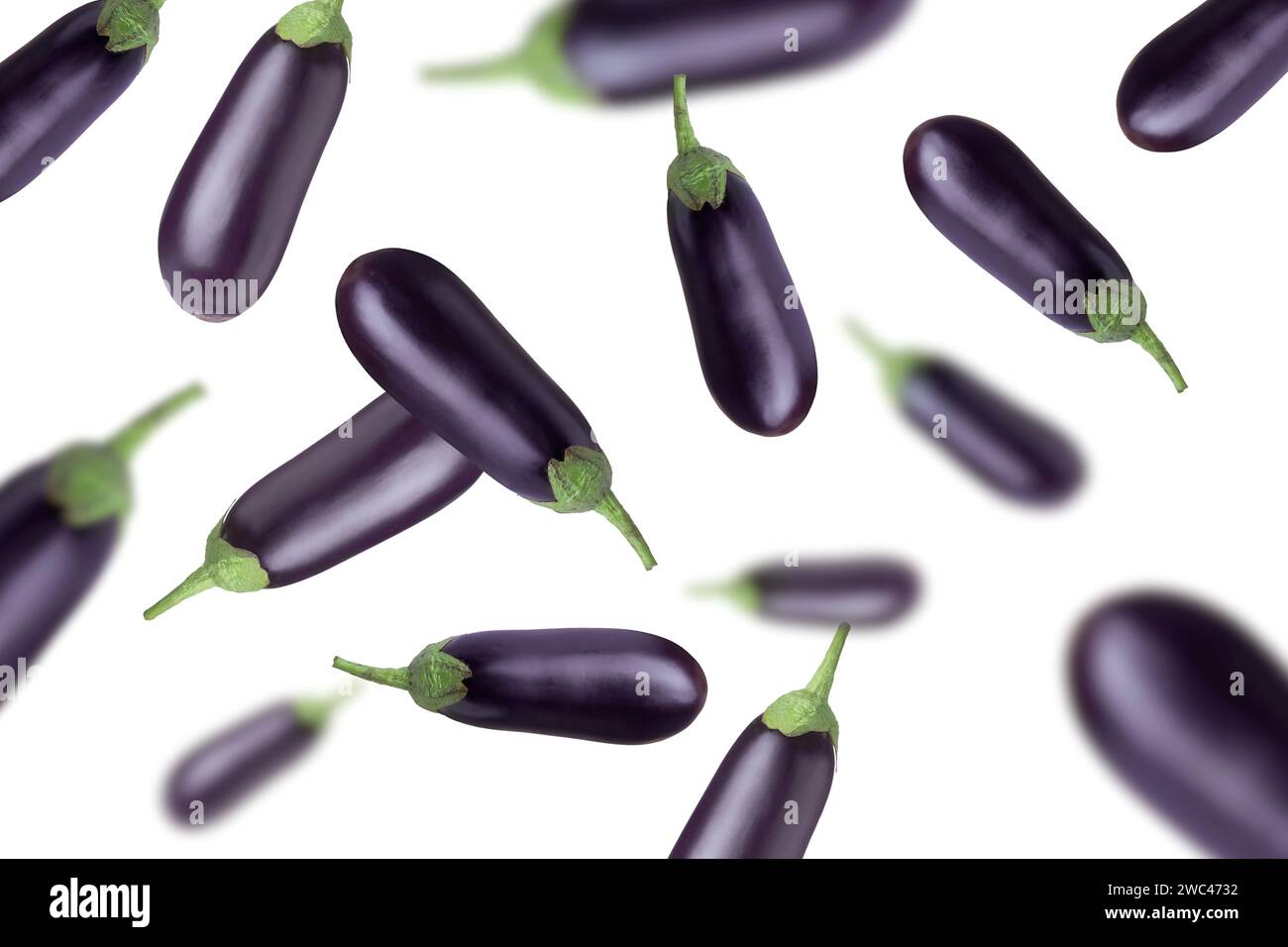 Fresh whole eggplants falling on white background Stock Photo - Alamy