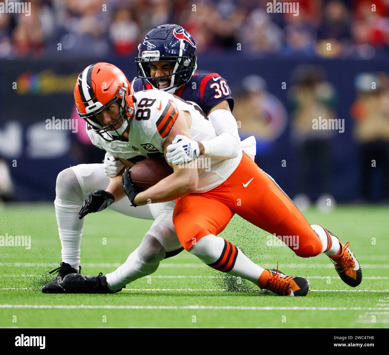 January 13, 2024: Texans safety DeAndre Houston-Carson (30) tackles ...