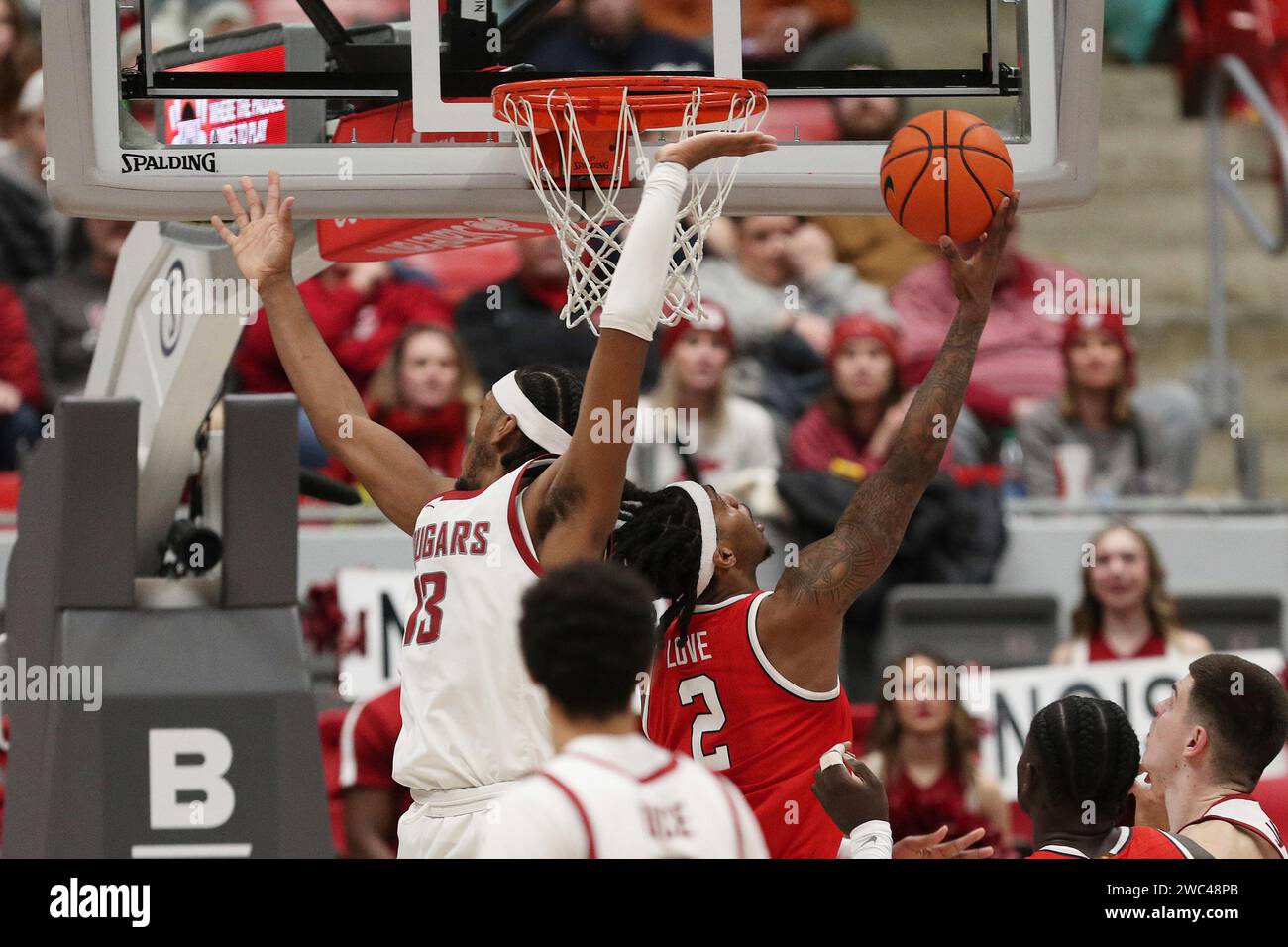 Arizona guard Caleb Love (2) shoots while pressured by Washington State ...