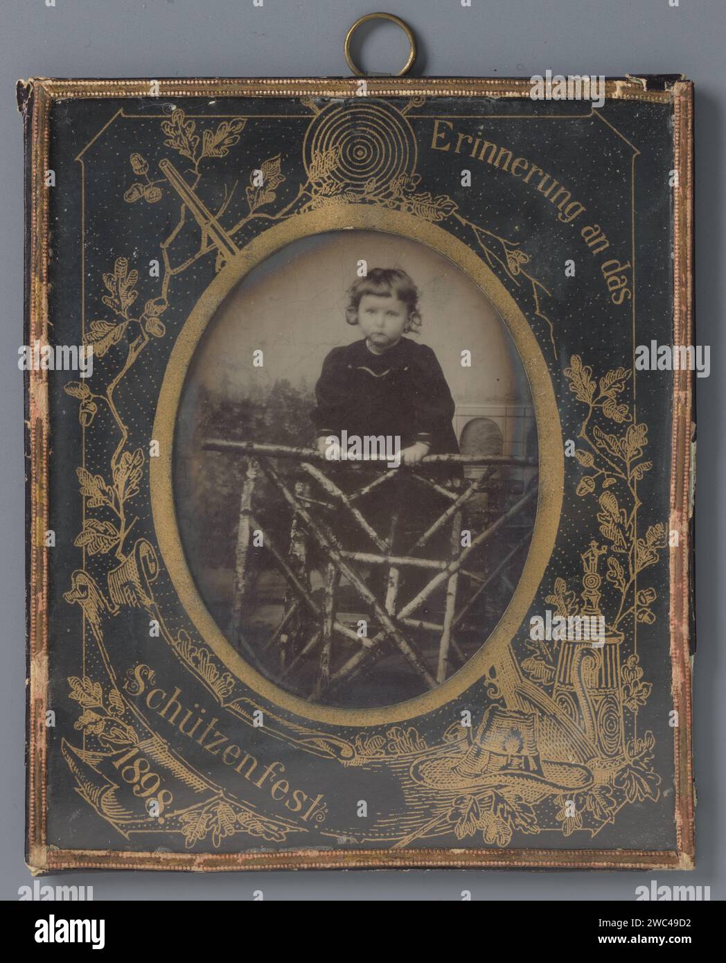 Portrait of a girl standing by a fence, Anonymous, 1898 photograph ...