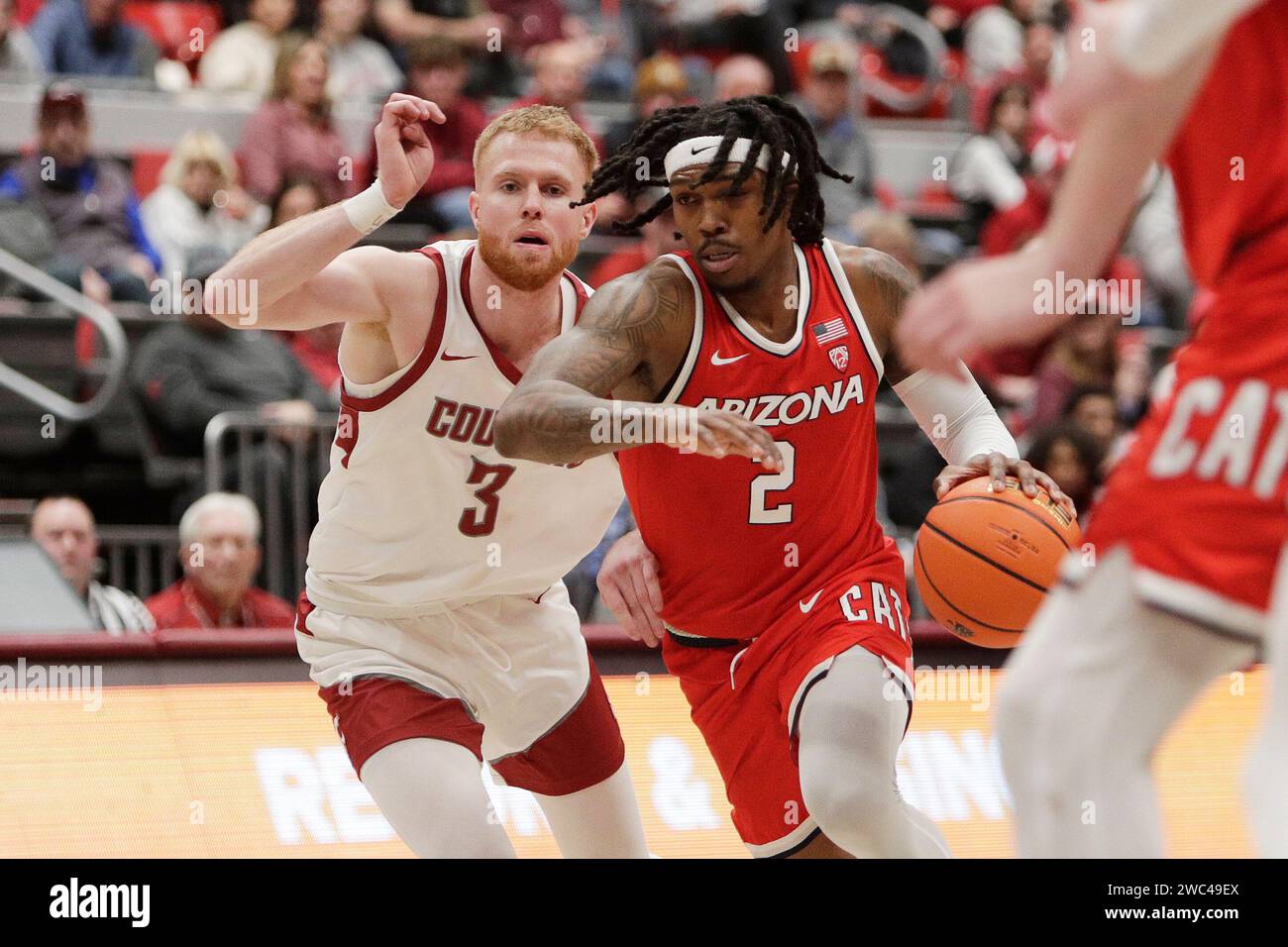 Arizona guard Caleb Love (2) drives while pressured by Washington State ...