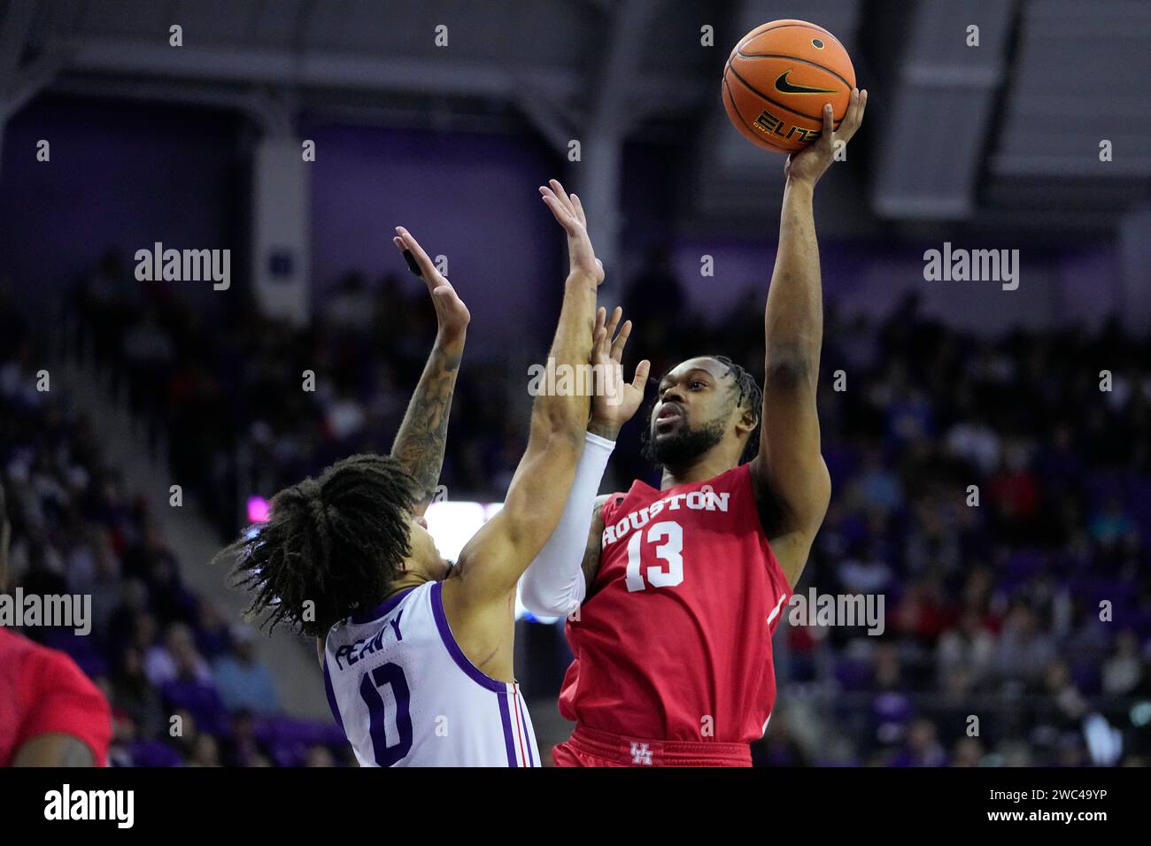 Houston forward J'Wan Roberts (13) shoots against TCU guard Micah Peavy ...