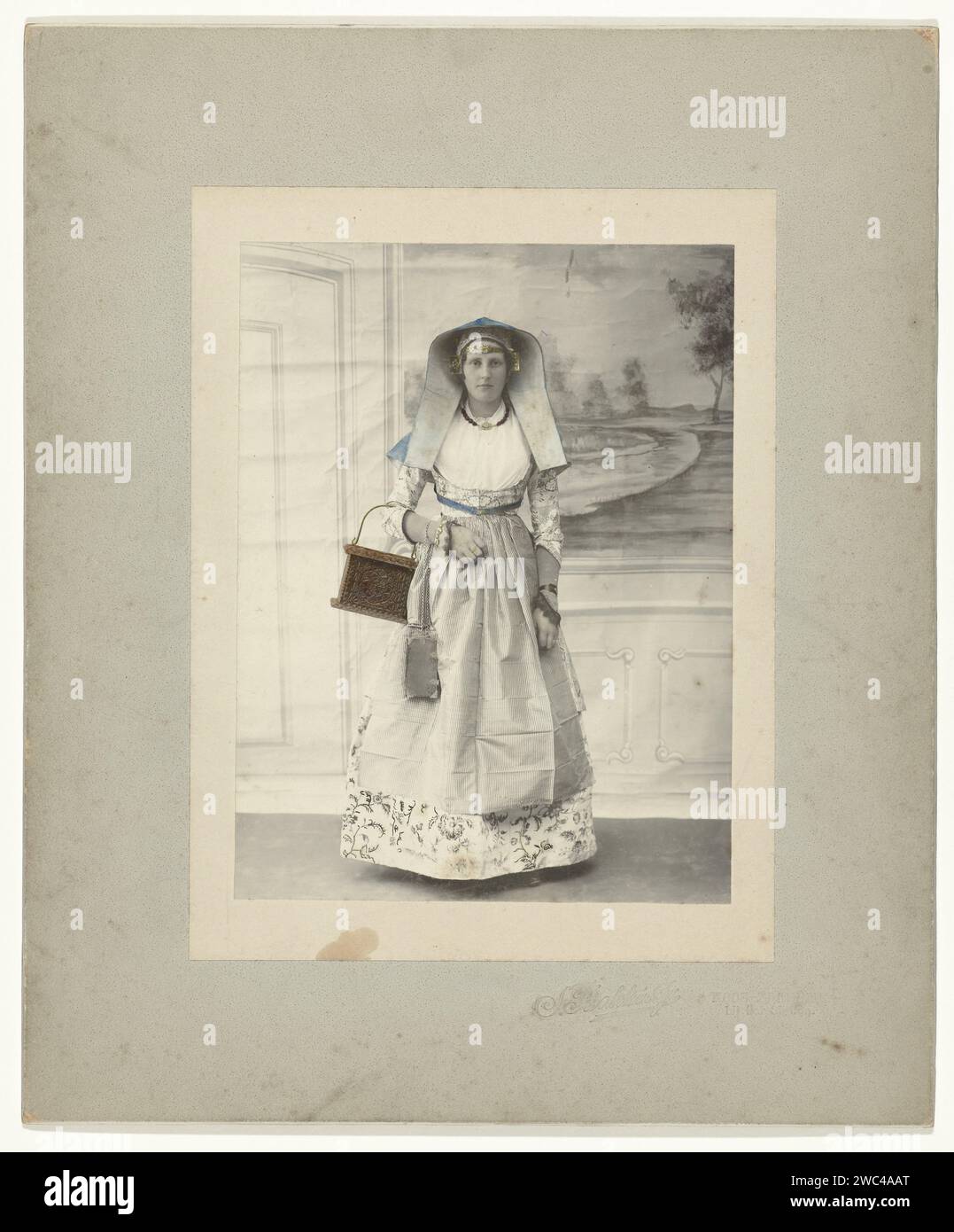 Portrait of a woman in Zaanse traditional costumes posing for a ...
