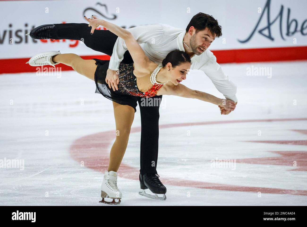 Deanna Stellato-Dudek and Maxime Deschamps, of Quebec, perform during ...