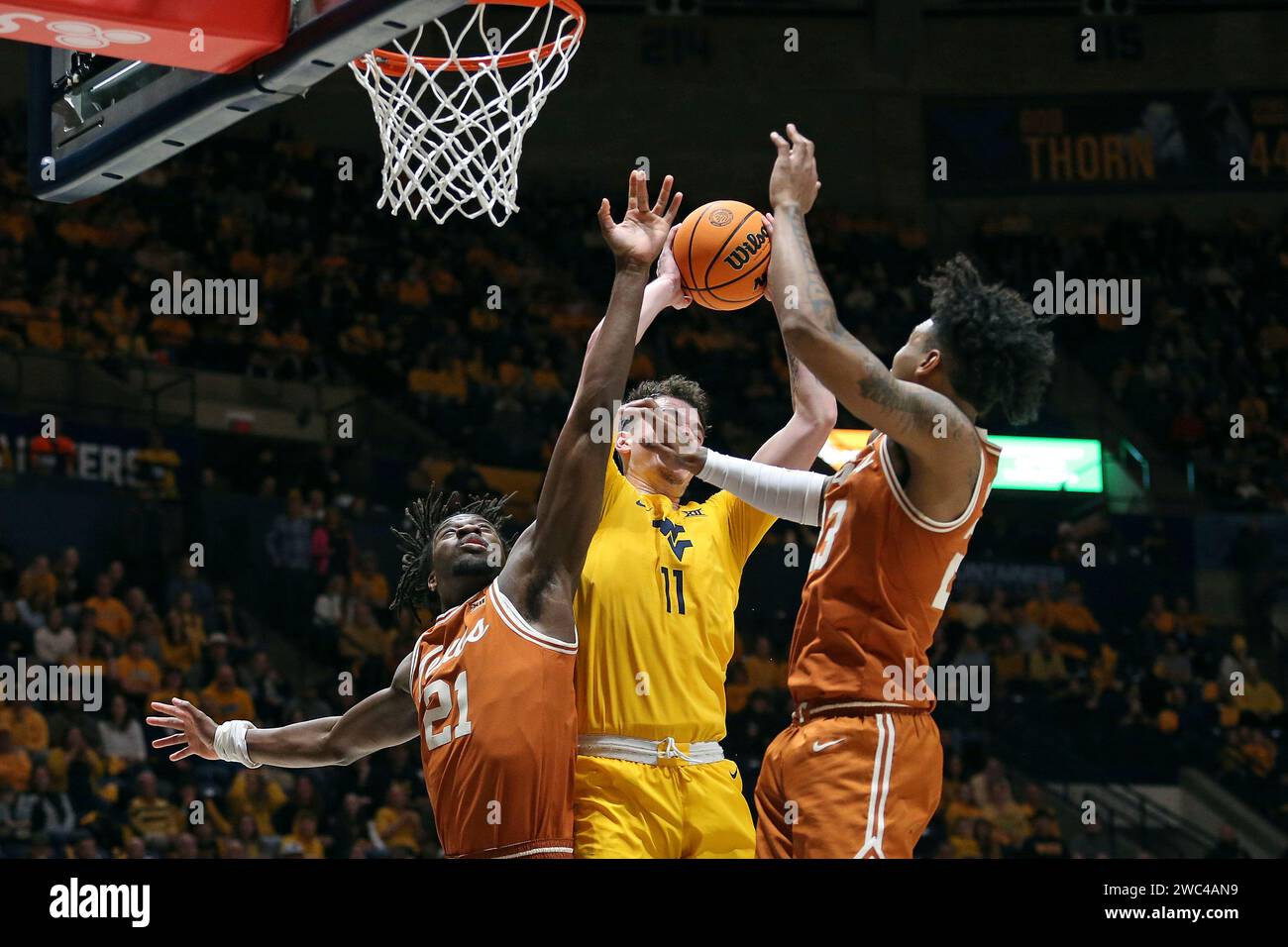 West Virginia forward Quinn Slazinski (11) is defended by Texas ...