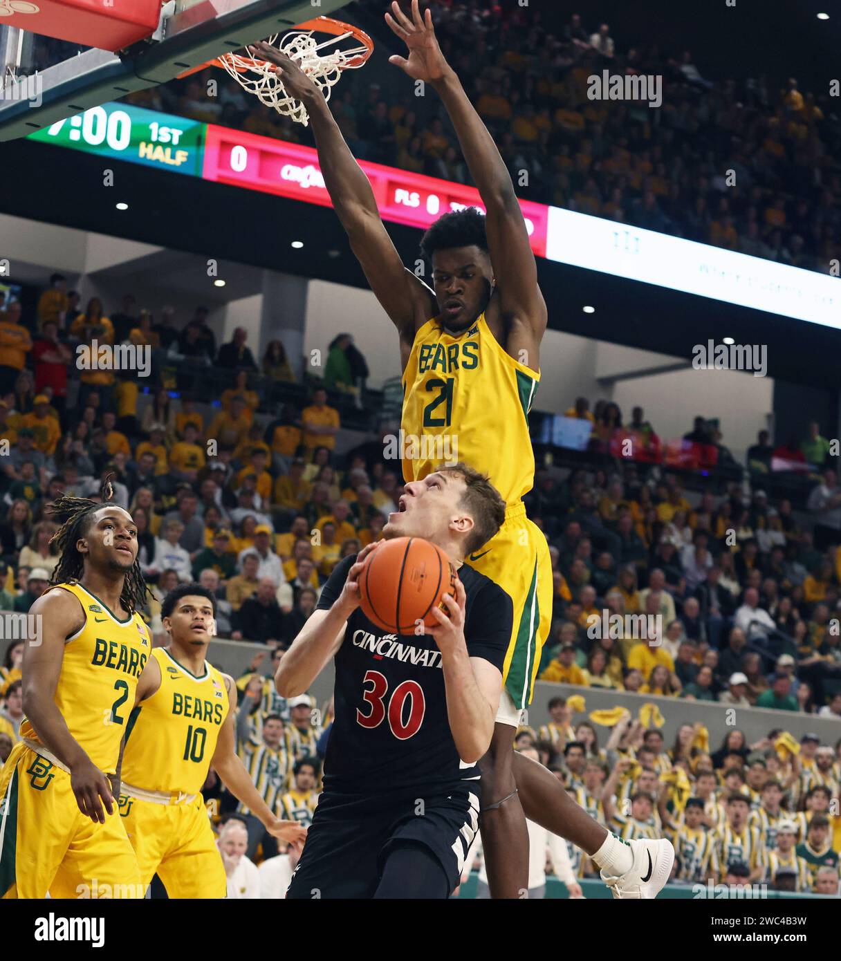 Baylor center Yves Missi defends against Cincinnati forward Viktor ...