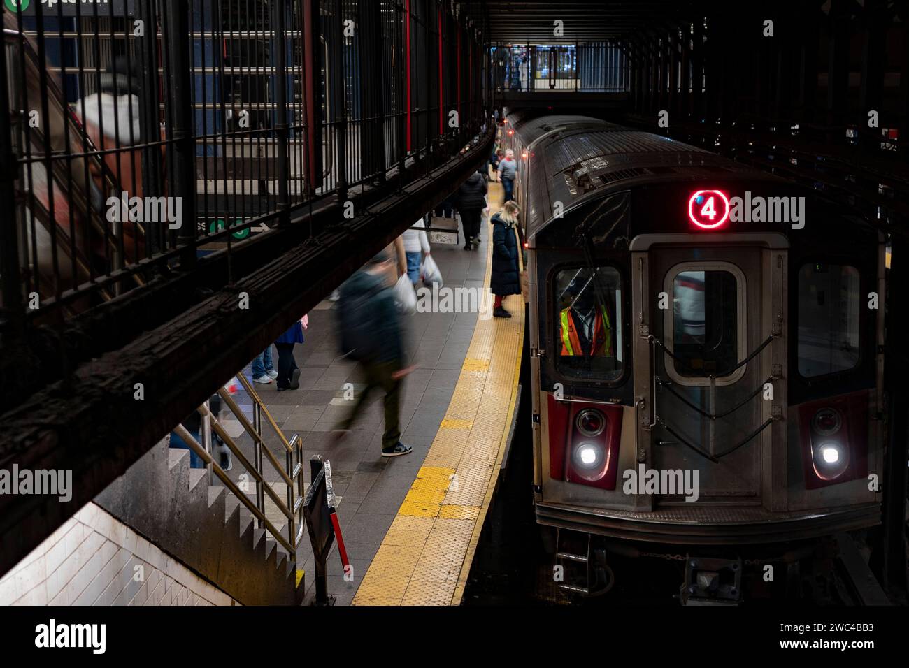Passengers board a train at Union Square subway station on Saturday ...