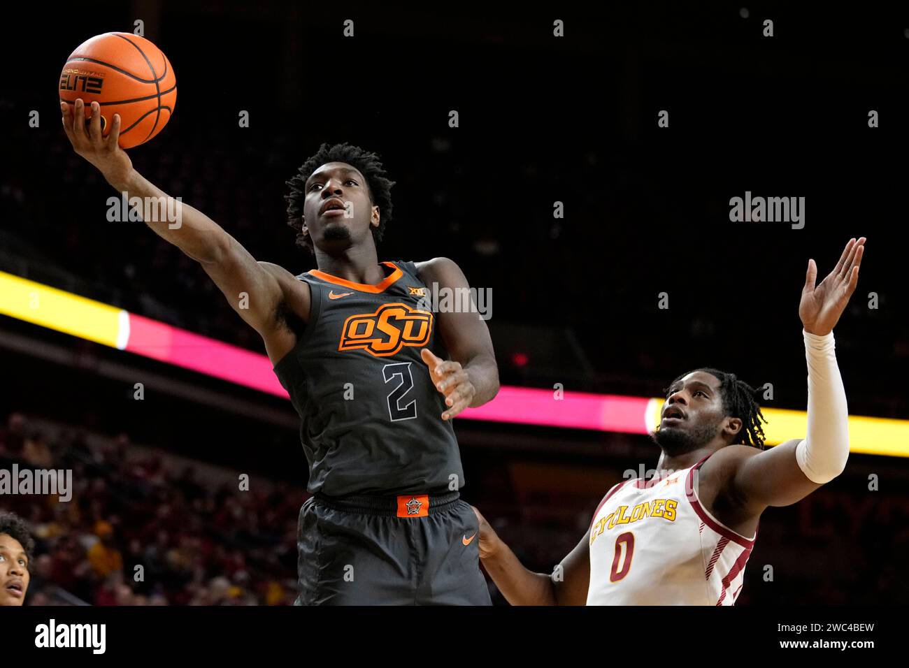 Oklahoma State forward Eric Dailey Jr. (2) drives to the basket past ...