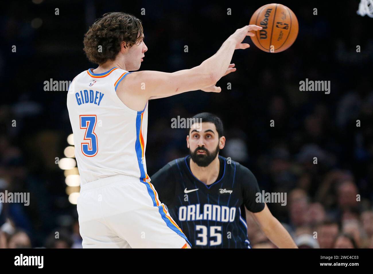 Oklahoma City Thunder guard Josh Giddey (3) passes the ball near Orlando Magic center Goga ...