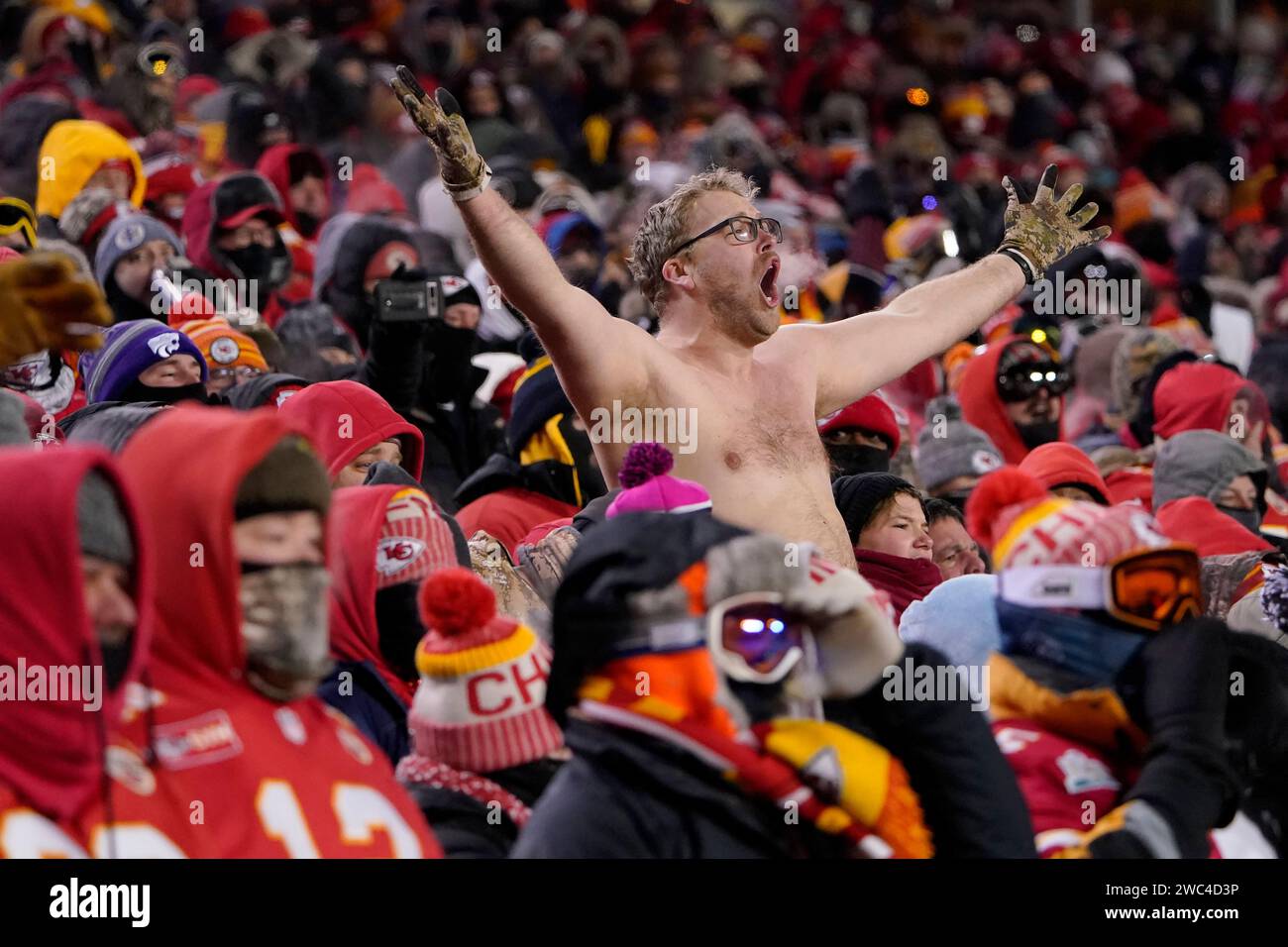 A fan not wearing a shirt gestures during the first half of an NFL wild ...