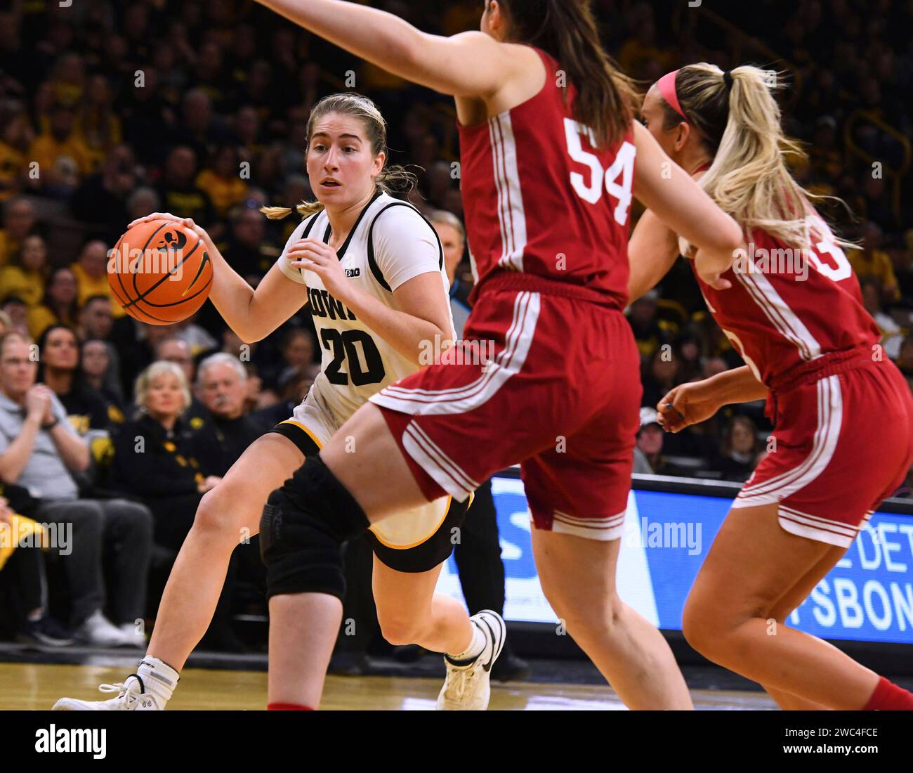 Iowa guard Kate Martin (20) drives past Indiana forward Mackenzie ...