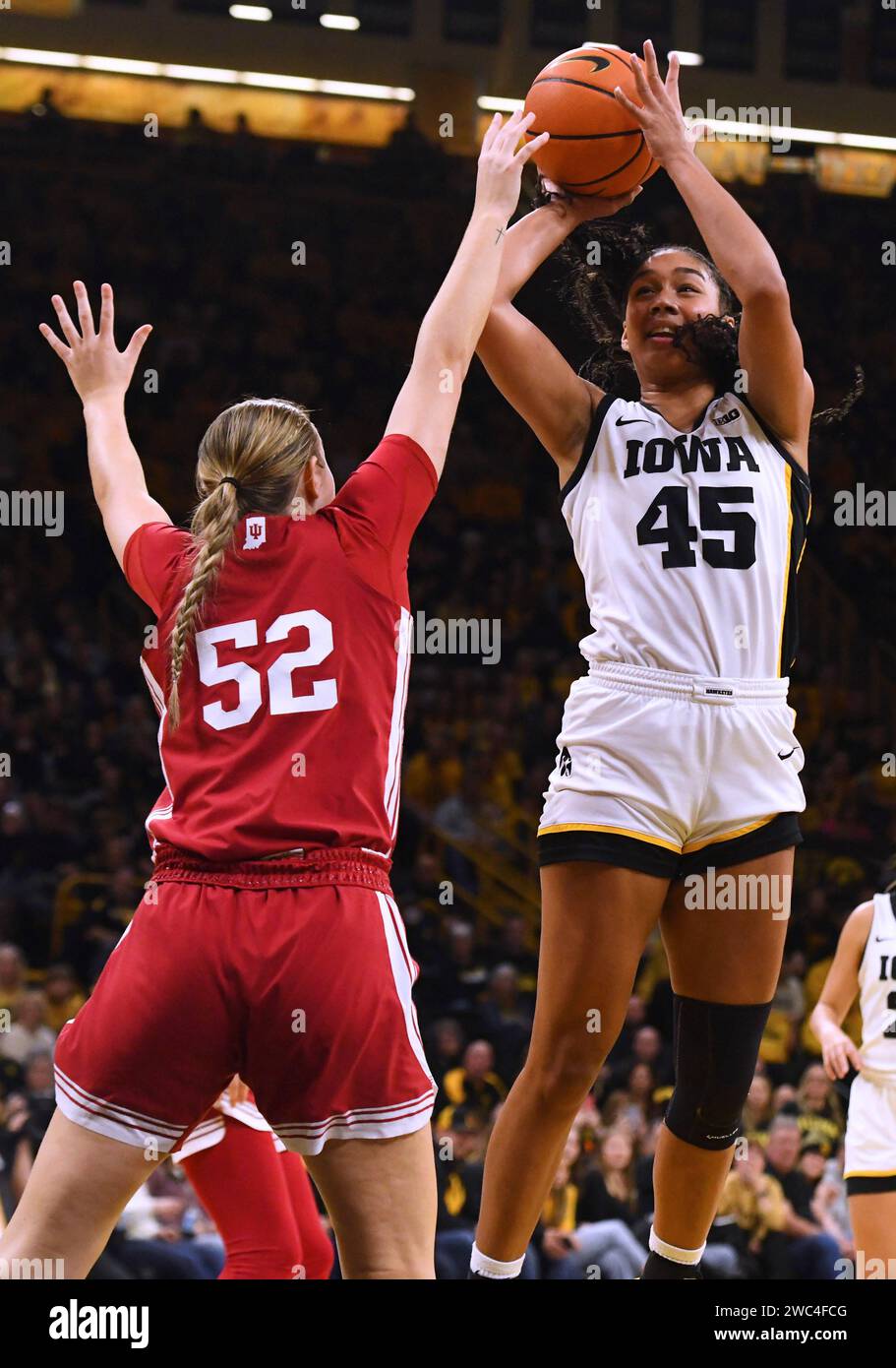 Iowa forward Hannah Stuelke (45) shoots over Indiana forward Lilly ...