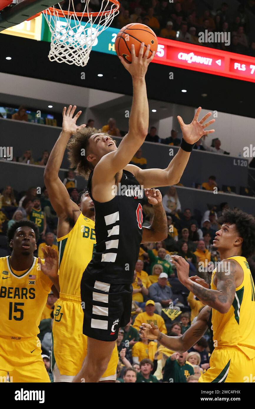 Cincinnati guard Dan Skillings (0) scores past Baylor defenders during ...