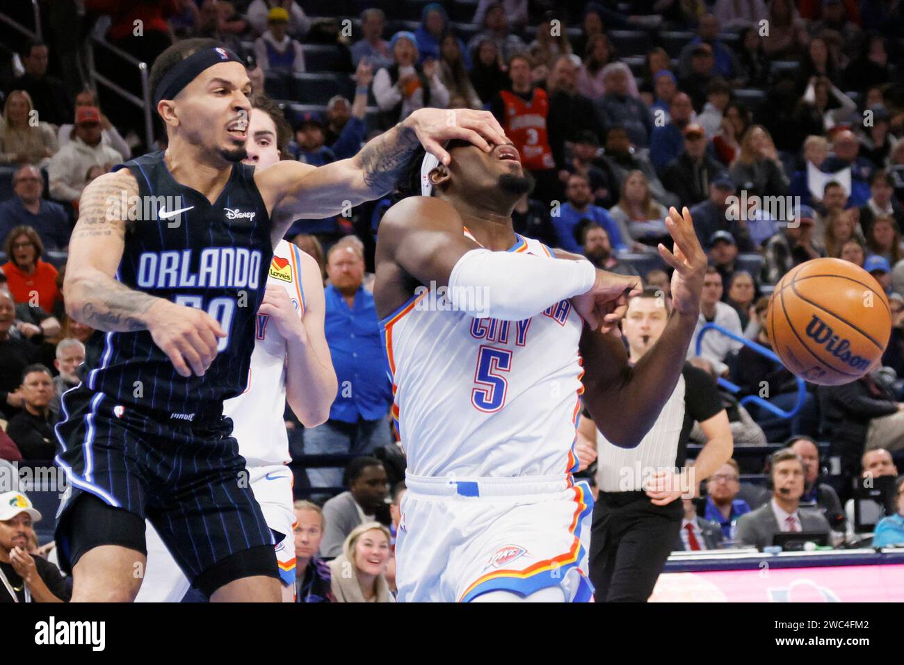 Orlando Magic guard Cole Anthony, left, fouls Oklahoma City Thunder ...