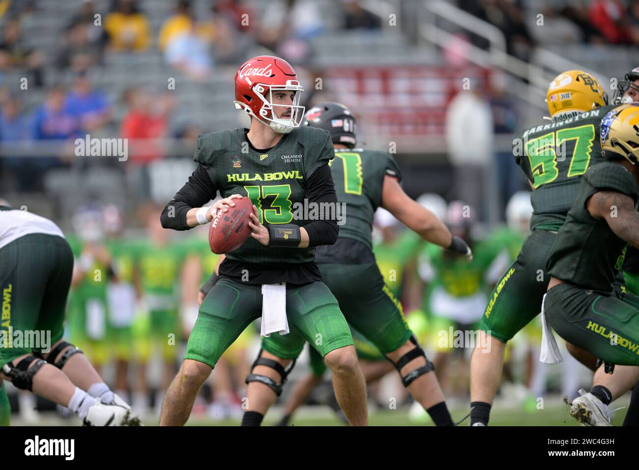 Team Kai quarterback Jack Plummer (13), of Louisville, looks for a ...