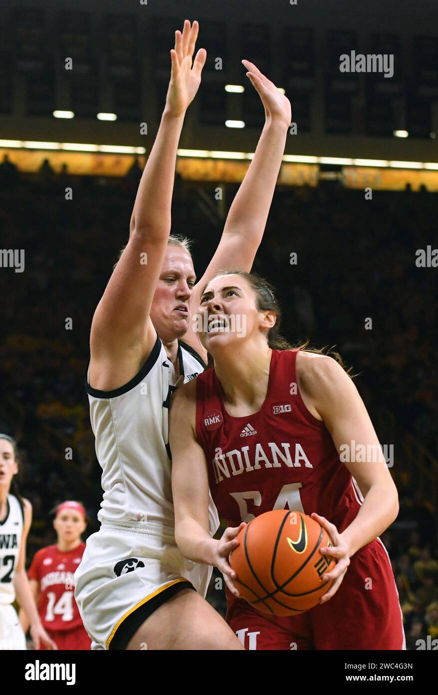 Indiana forward Mackenzie Holmes (54) drives to the basket past Iowa ...