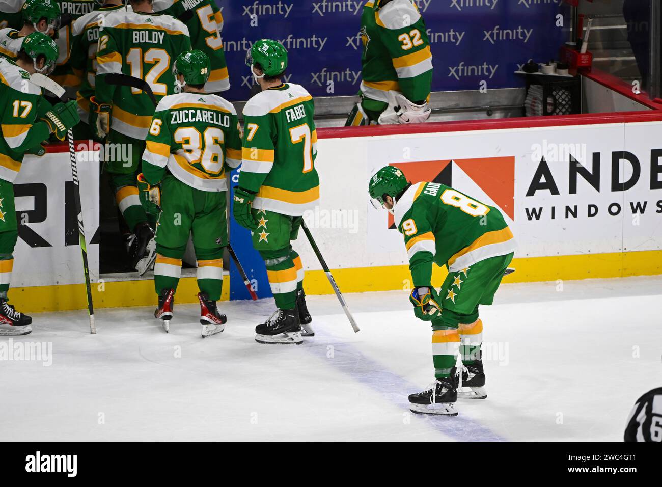 Minnesota Wild center Frederick Gaudreau, right, takes a moment as his ...