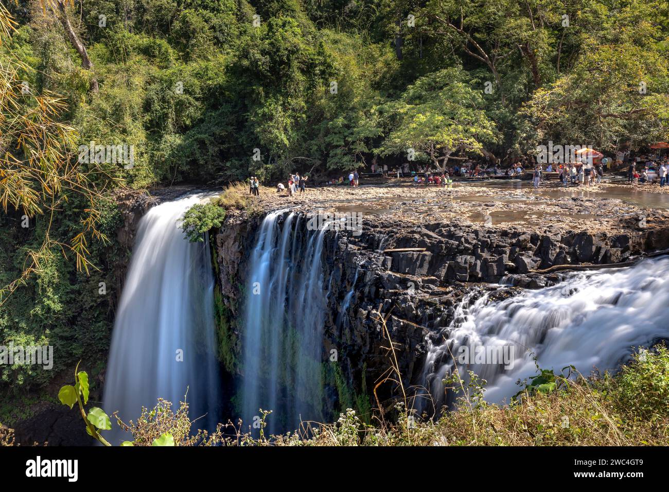 Bousra Waterfall, Pech Chreada, Cambodia - December 31, 2023: tourists ...