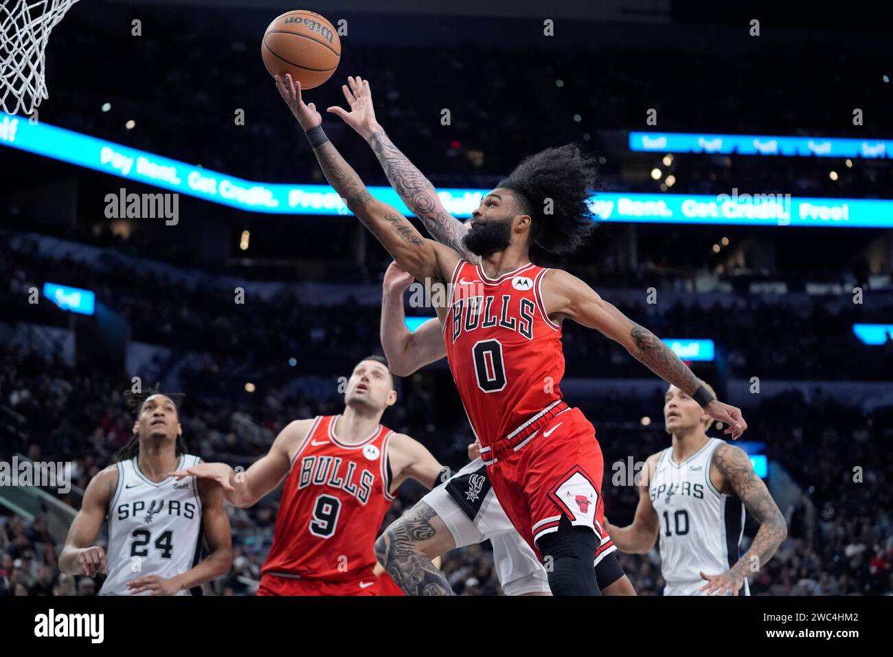 Chicago Bulls guard Coby White (0) scores against the San Antonio Spurs ...