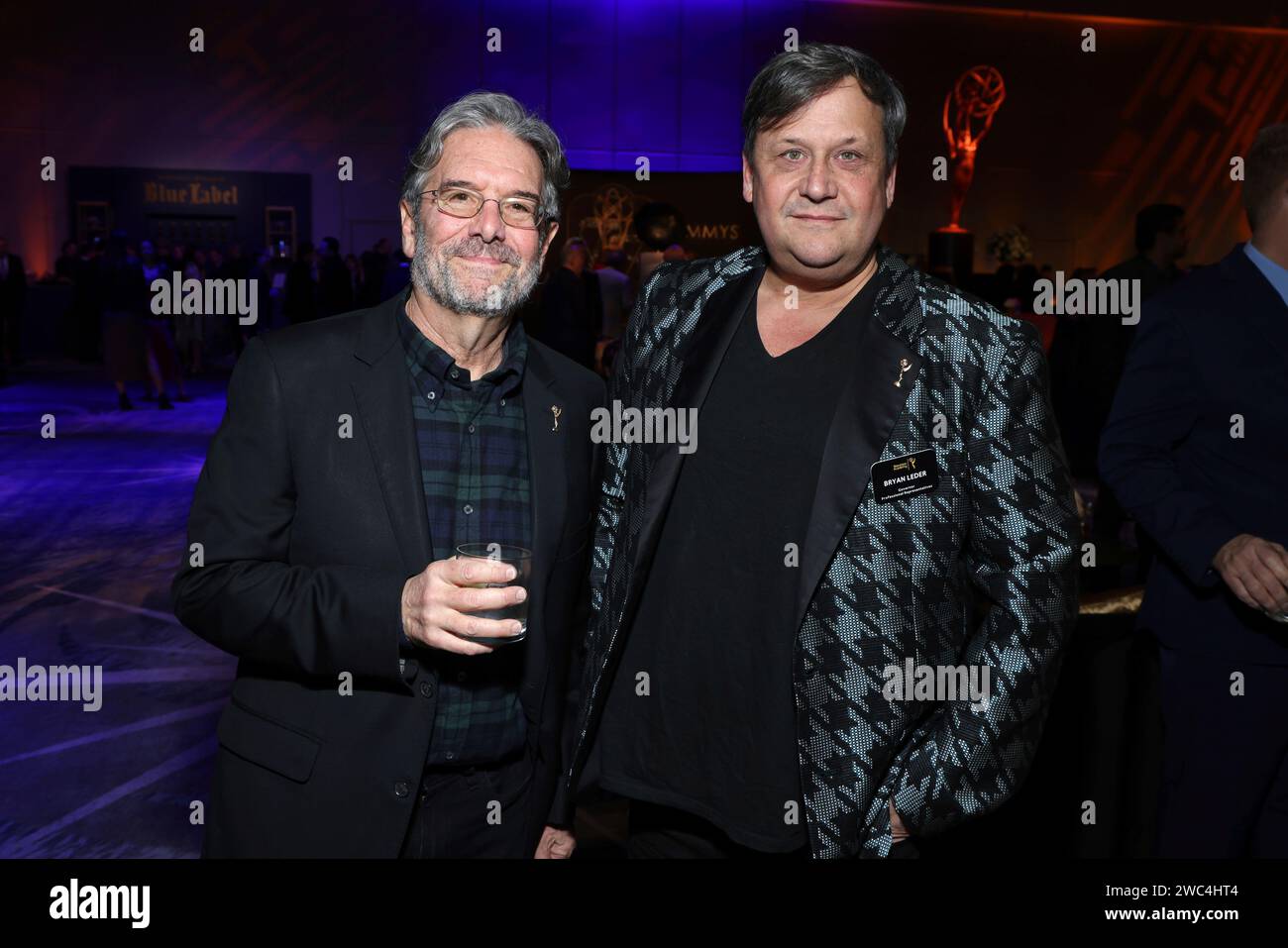 Peter Golden, left, and Bryan Leder attend the 75th Emmy Awards ...