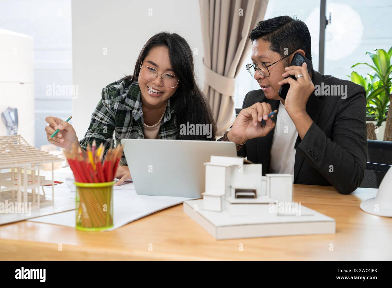 Architects and owner working on construction site Stock Photo - Alamy