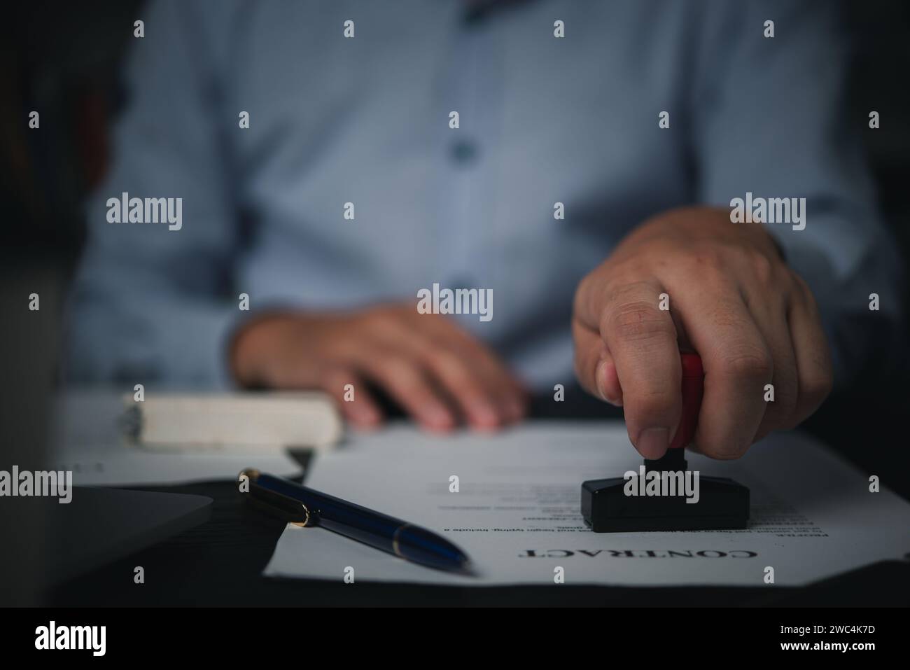 Authorized person rubber stamps contract certificates and office ...