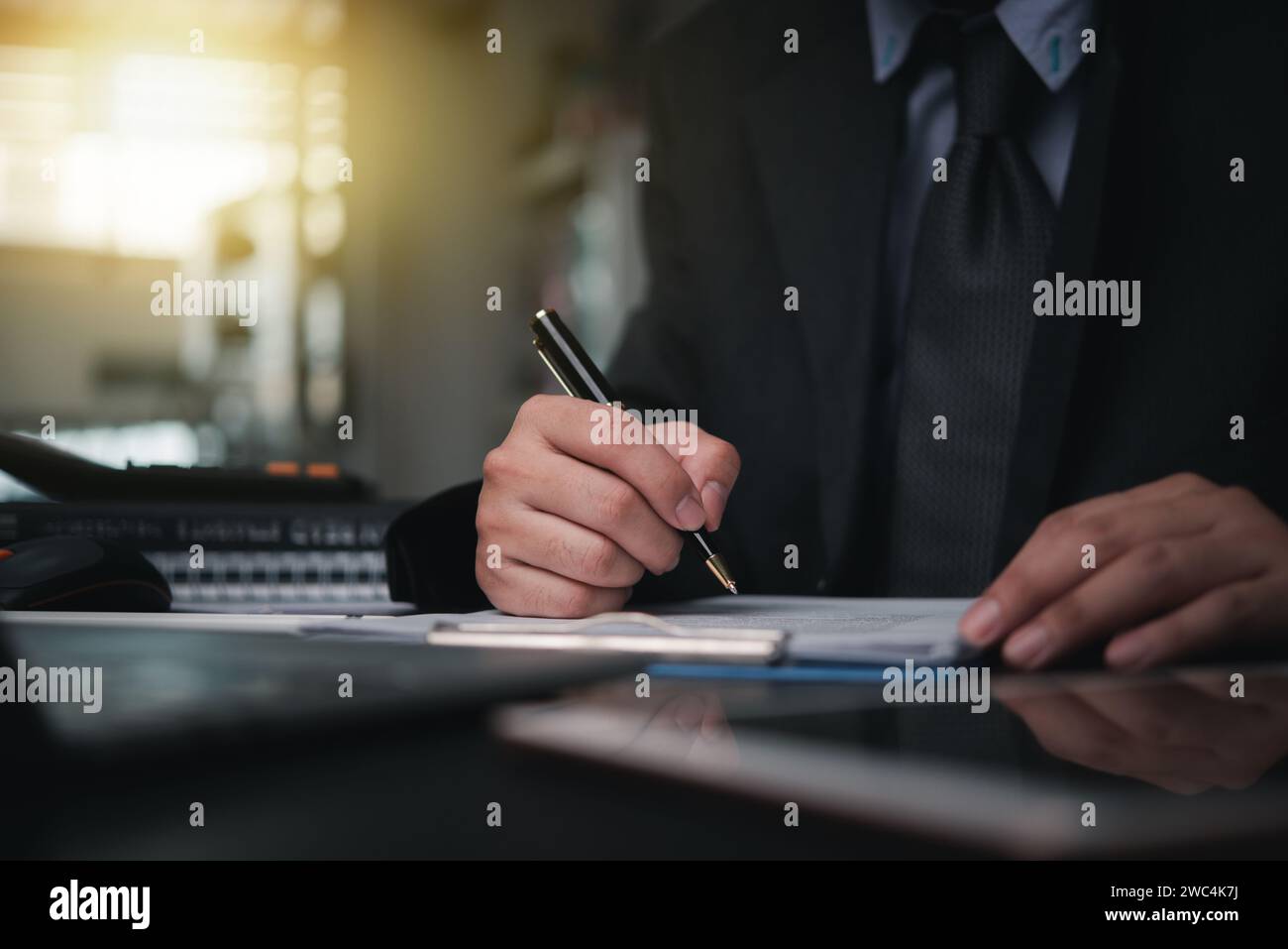 Business person Writing contract law and paper work for business and ...