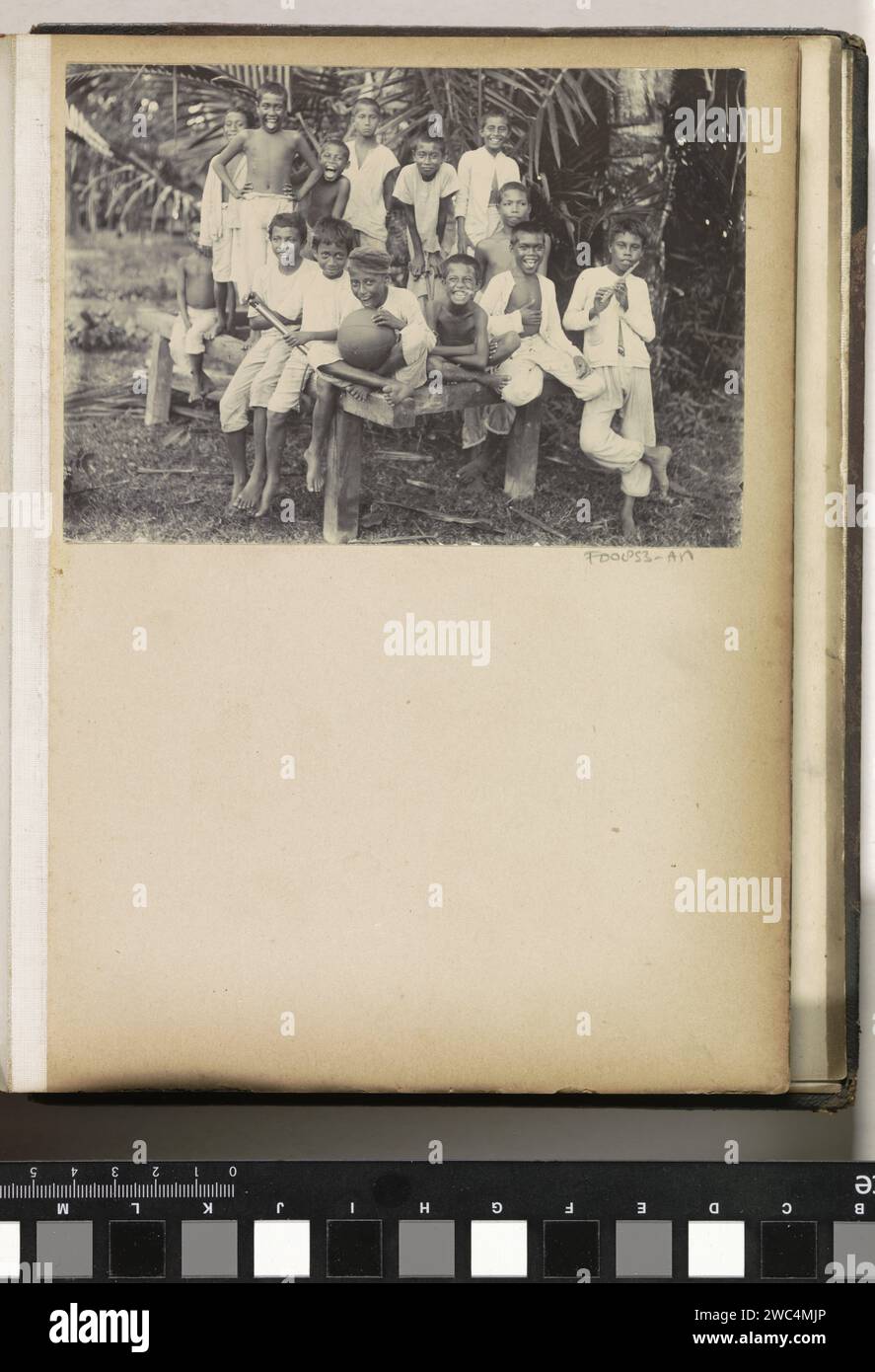 Smiling children with flute, ball and bicycle pump on Ambon, Anonymous ...