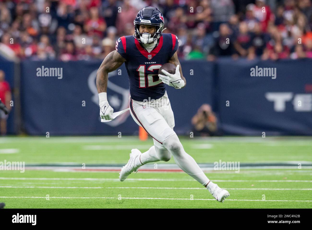 Houston, TX, USA. 13th Jan, 2024. Houston Texans wide receiver Nico Collins (12) runs after ...