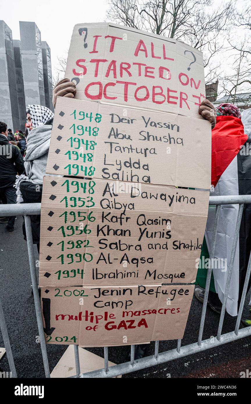 A protester holds a placard expressing her opinion during International ...