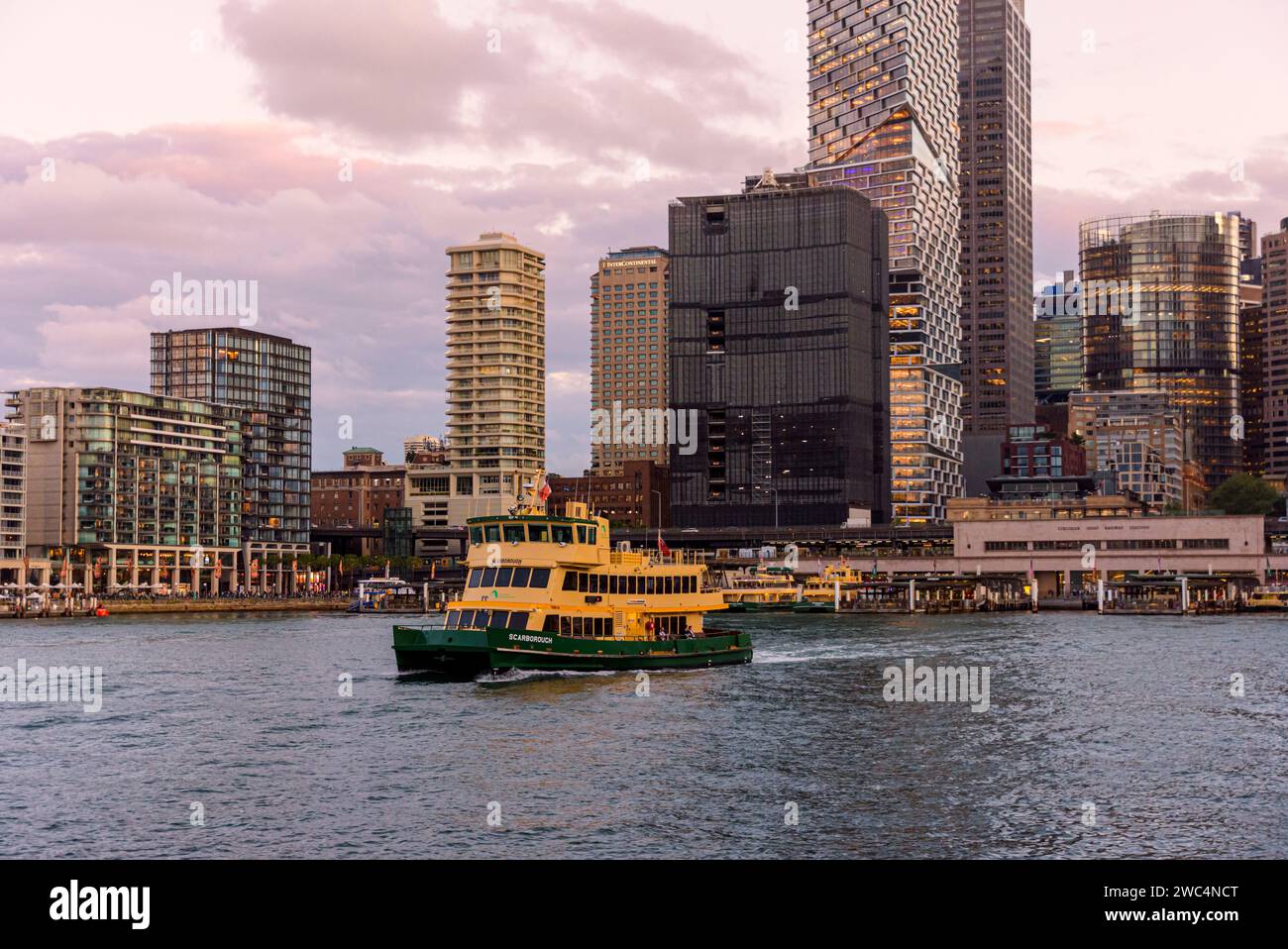 Sydney Harbour Ferry leaves Circular Quay at sunset, Sydney, New South ...