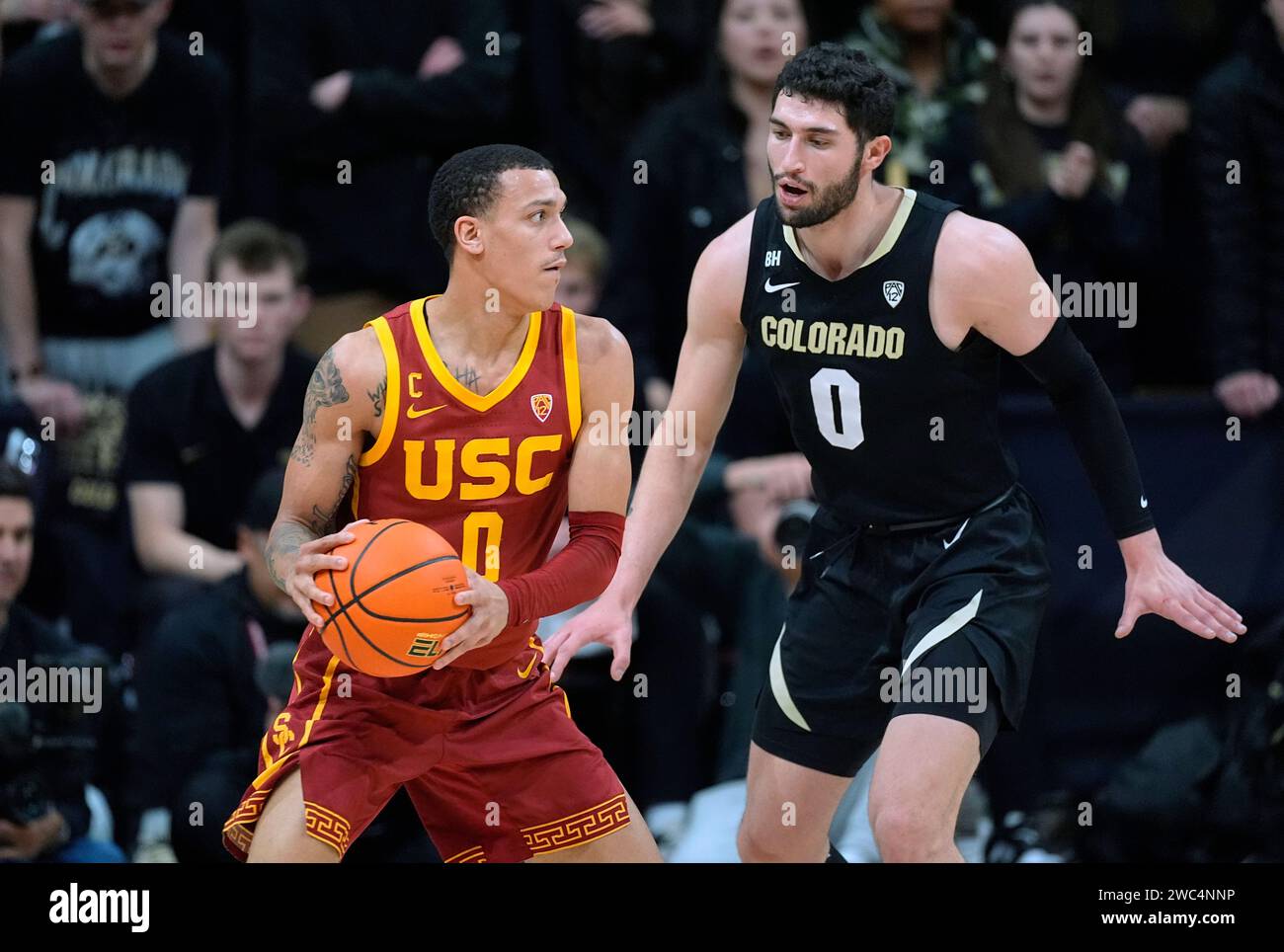 Southern California guard Kobe Johnson, left, looks to pass the ball as ...