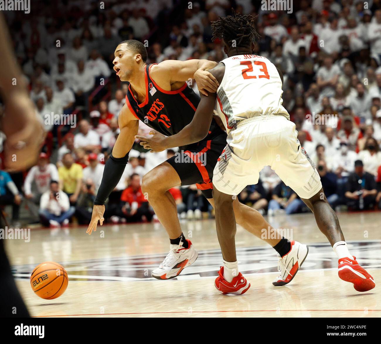 San Diego State forward Jaedon LeDee tries to dribble past New Mexico ...