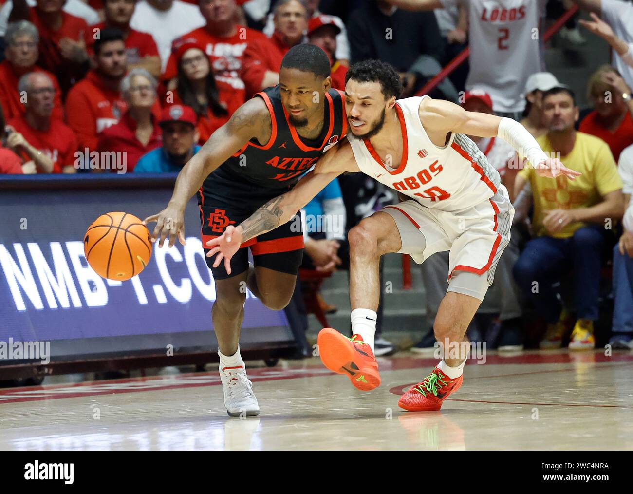 New Mexico guard Jaelen House tries to steal the ball from San Diego ...
