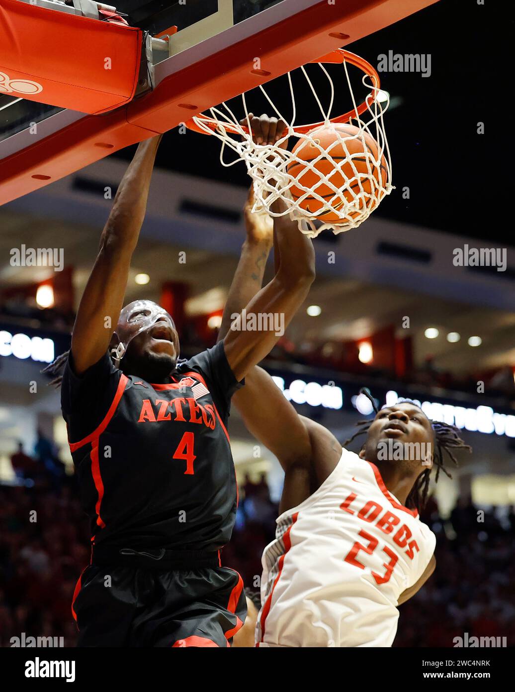 San Diego State forward Jay Pal dunks in front of New Mexico center ...