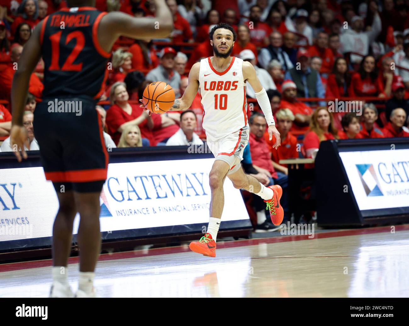 New Mexico guard Jaelen House dribble up court as San Diego State guard ...