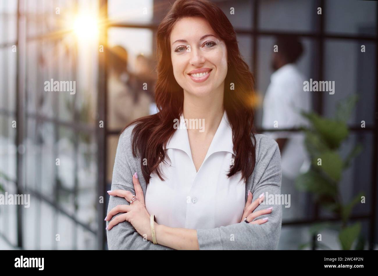 Confident young woman in a closed pose. Office professions Stock Photo ...