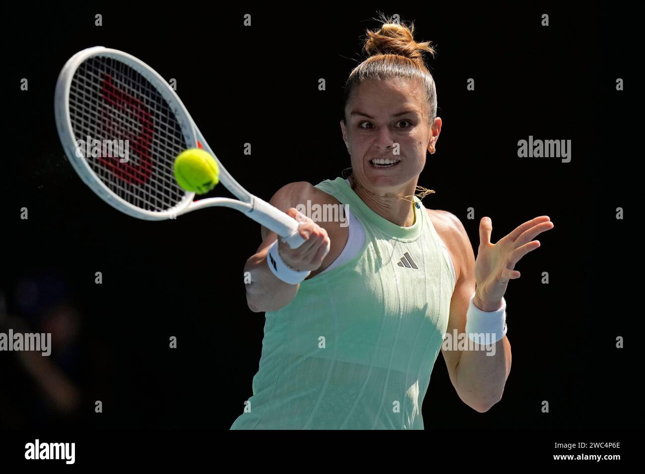 Maria Sakkari of Greece plays a forehand return to Nao Hibino of Japan ...