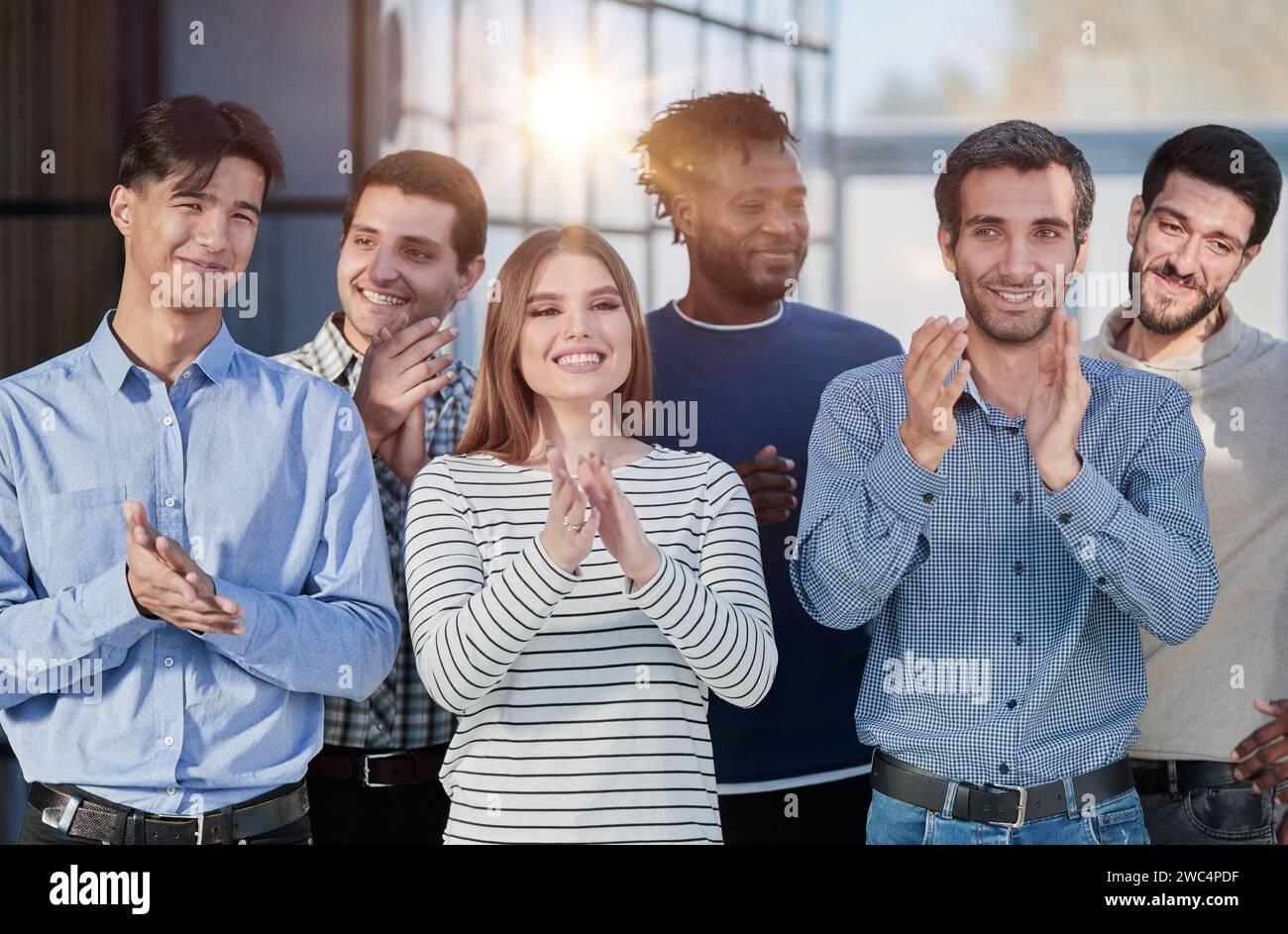 Happy employees clapping boss hi-res stock photography and images - Alamy