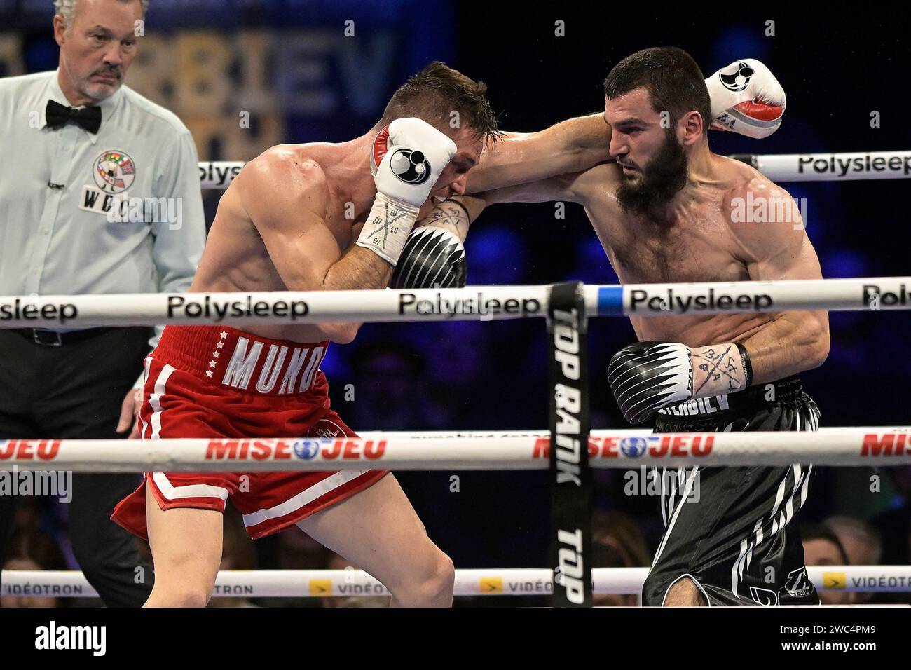 Quebec, Canada. 14th Jan, 2024. Artur Beterbiev, left, and Callum Smith ...
