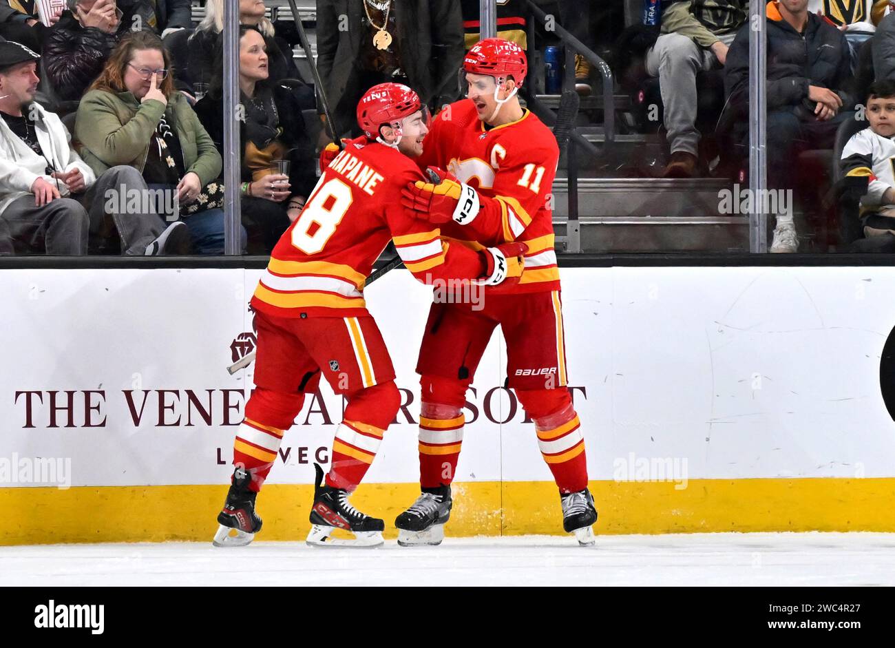 Calgary Flames left wing Andrew Mangiapane (88) and center Mikael ...