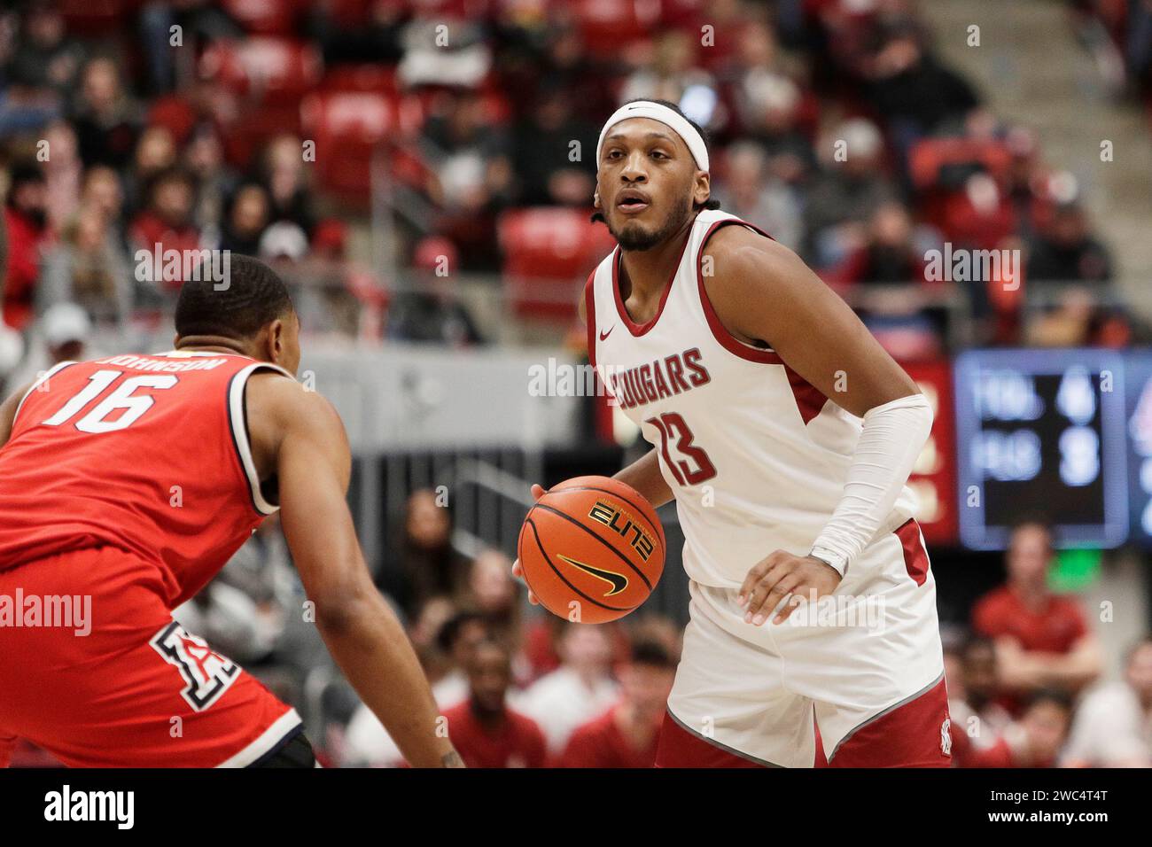 Washington State forward Isaac Jones (13) controls the ball while ...